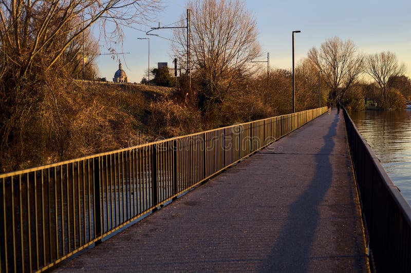 Paved Footbridge in a Park Over a Lake at Sunset Stock Image - Image of ...