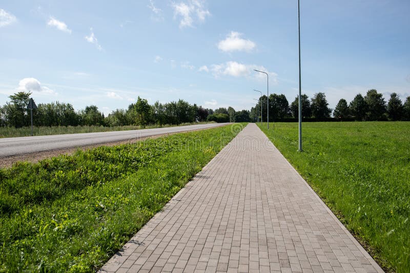 Paved Pedestrian Path Along the Highway. Rural Area Stock Image - Image ...