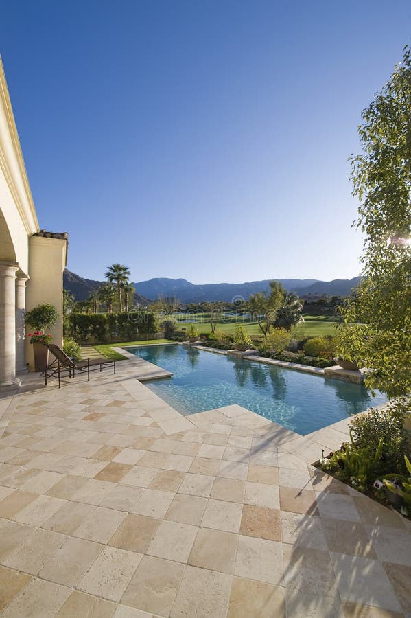 Paved Poolside Area stock photo. Image of tree, mountain - 33911920