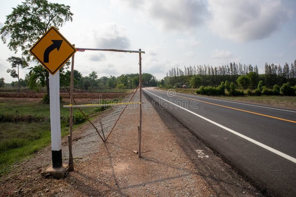 The Paved Road Has a Symbol on the Side of the Road and a Beautiful ...