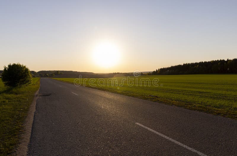 Paved Road in the Spring Season during Sunset Stock Photo - Image of ...