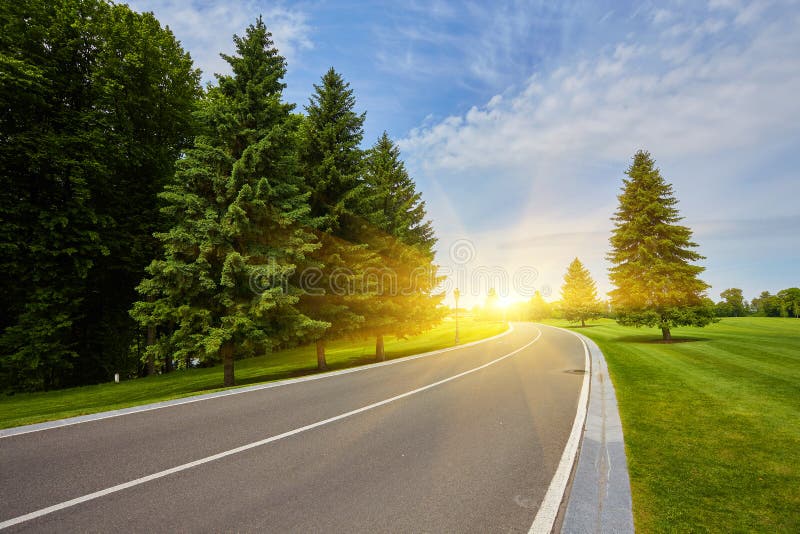 The Paved Road Up the Side of the Trees, a Freight Train on a Sunny Day ...