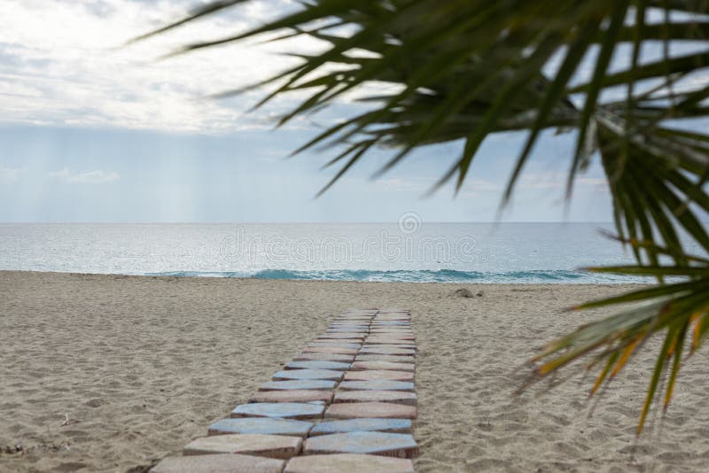 Paved Stone Path from the Beach To the Sea. Frame of Branches.sunset ...