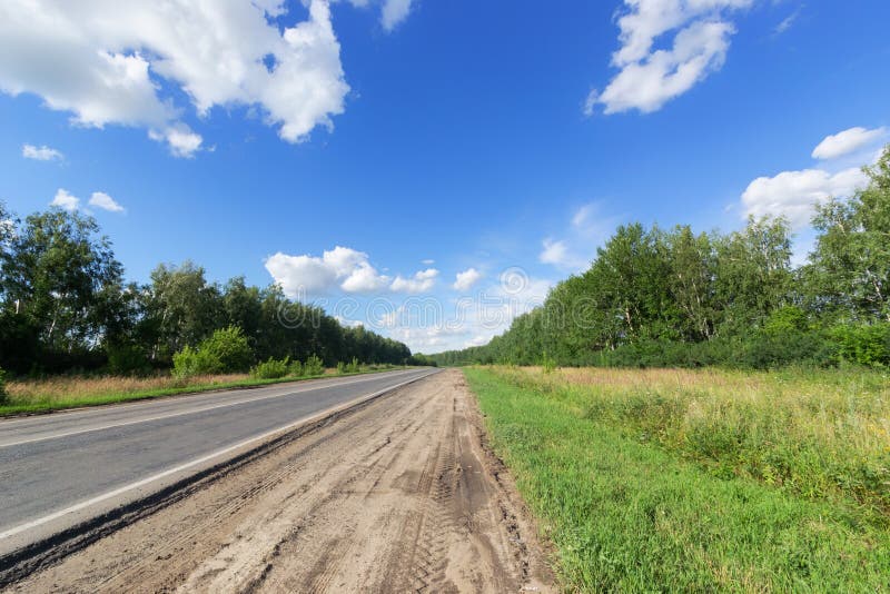 Paved and Unpaved Road, among the Birches Under the Blue Sky Stock ... Paved and Unpaved Road, among the Birches Under the Blue Sky Stock ...