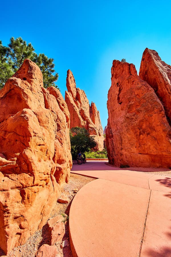 Paved Walking Path through Large Red Pillars of Rock and Blue Sky Stock ...