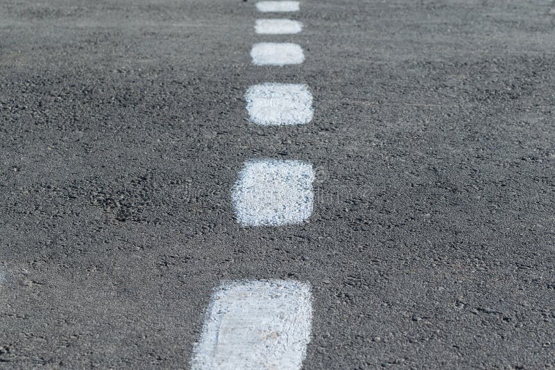 On the Pavement Marking. Rough Intermittent White Line. Stock Photo ...