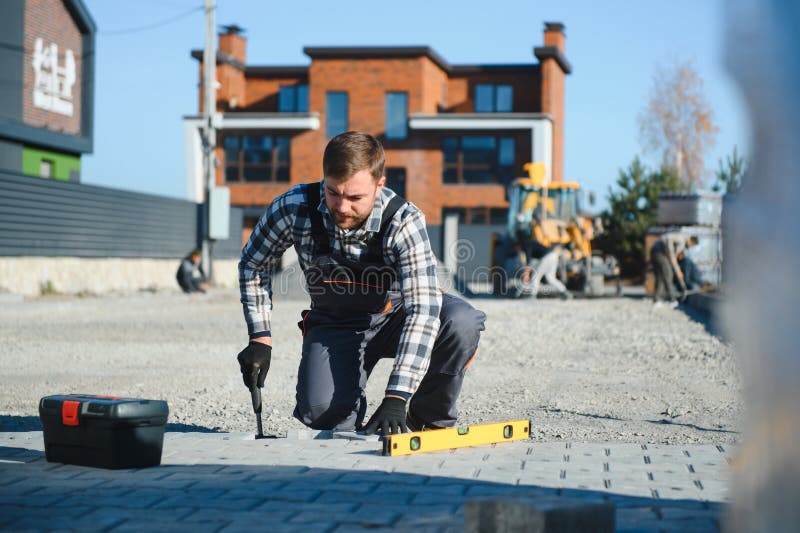 Paver Laying Driveway Pavement Out of Concrete Pavement Blocks Stock ...