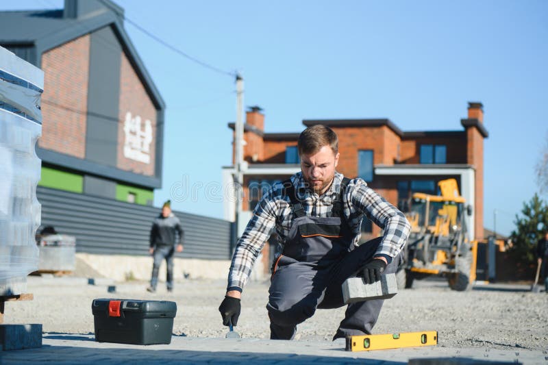 Paver Laying Driveway Pavement Out of Concrete Pavement Blocks Stock ...