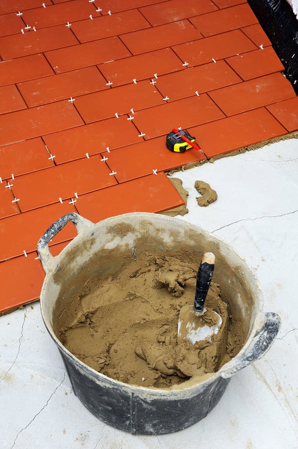 Paving the Floor of the Terrace of a House with Ceramic Tile Stock ...