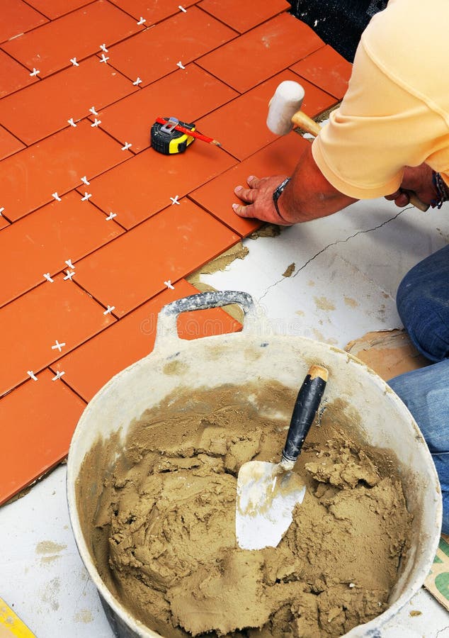 Paving the Floor of the Courtyard of a House with Ceramic Tile Stock ...
