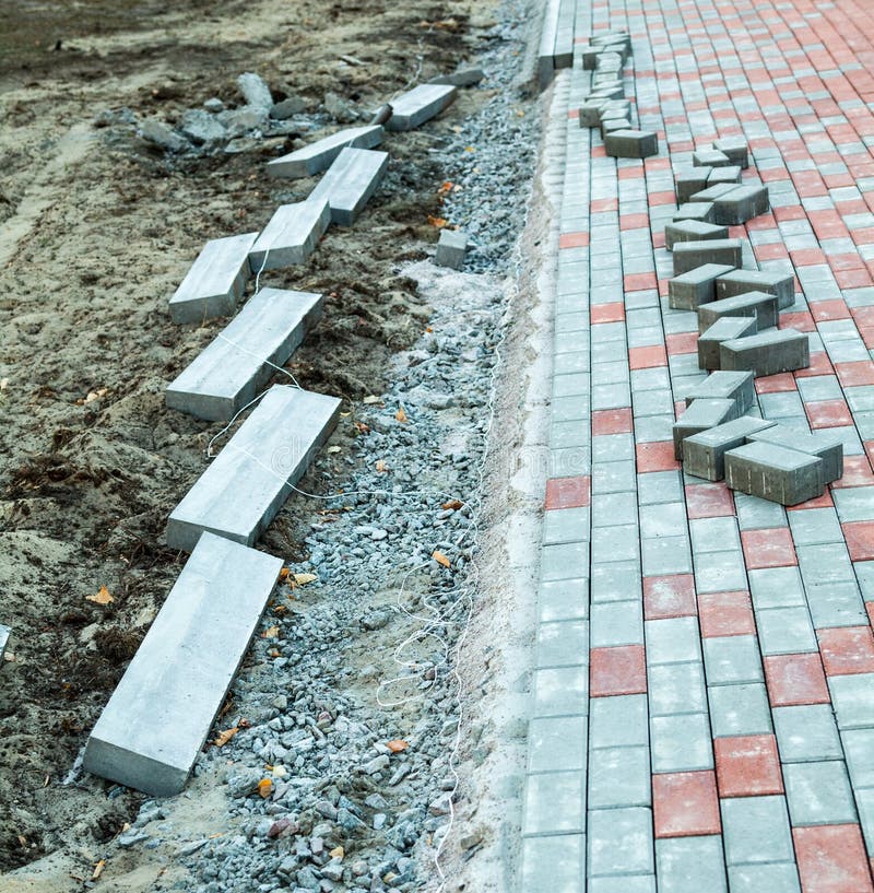 Paving the footpath stock image. Image of foot, material - 183437609