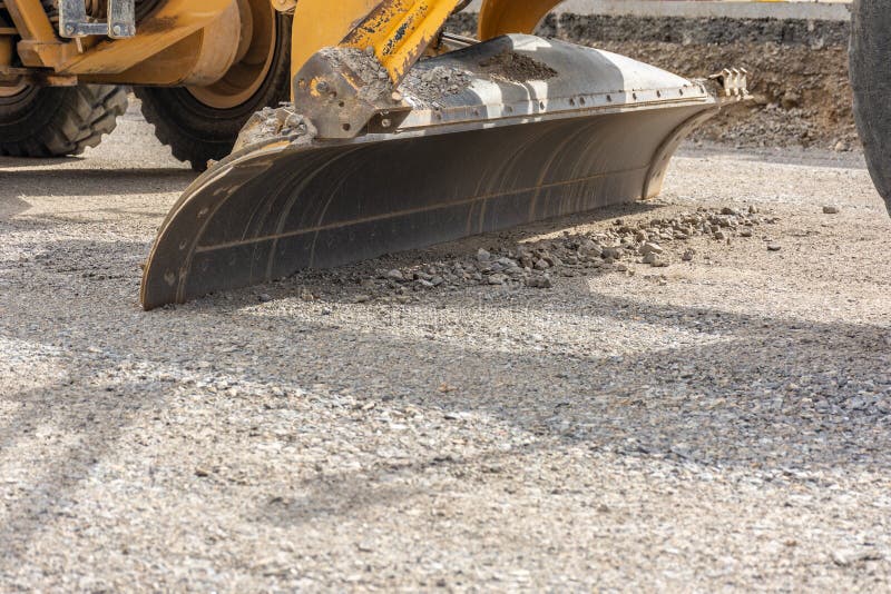 Paving the Ground at Road Construction Works with a Bulldozer Stock ...