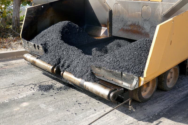 A Paving Machine Placing Fresh Asphalt or Bitumen on a Gravel Base ...