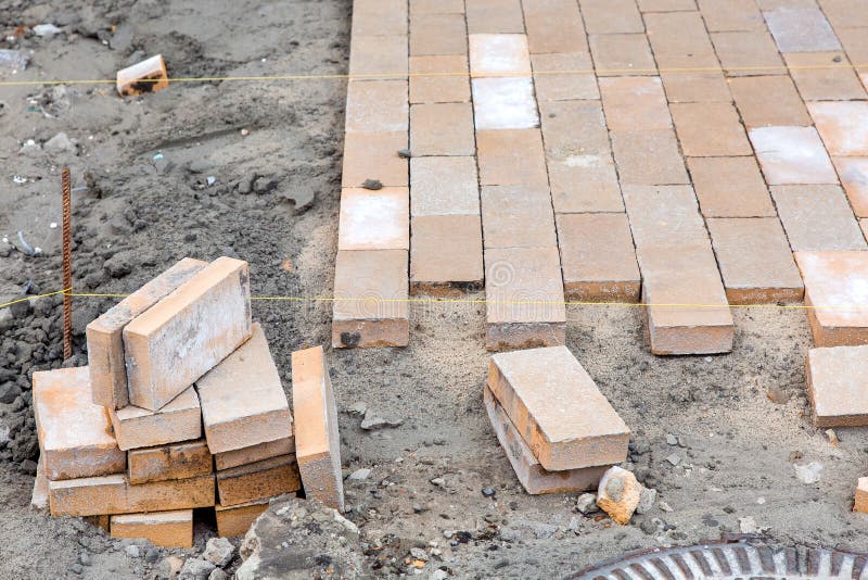 Paving Of A New Sidewalk From Rectangular Stone Tiles According To The ...