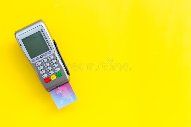 Pay by Card. Bank Card Inserted in Payment Terminal on Yellow ...