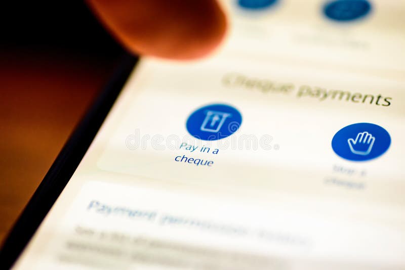 Pay in Cheque Button on Smartphone App Screen Closeup with Human Finger ...