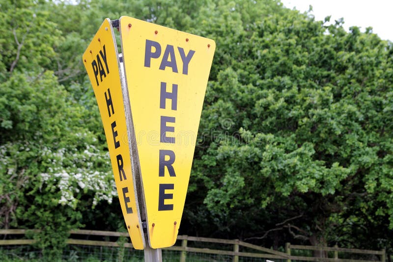 Pay here sign stock image. Image of signpost, signboard - 74617823