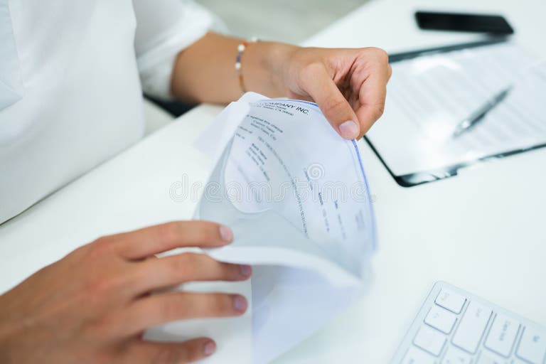 Paycheck in Open Envelope stock photo. Image of female - 219158696