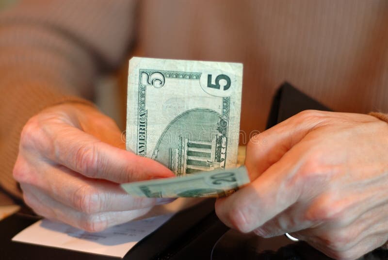 Paying the Bill with Twenty Five Dollars Stock Image - Image of ...