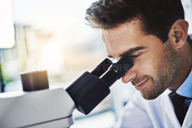 Paying Close Observation To His Findings. a Scientist Using a ...