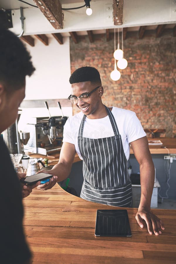 Paying for Coffee Has Never Been Easier. a Man Using a Smartphone To ...