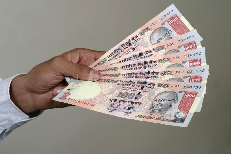 Paying in indian rupee stock image. Image of currency - 5402499