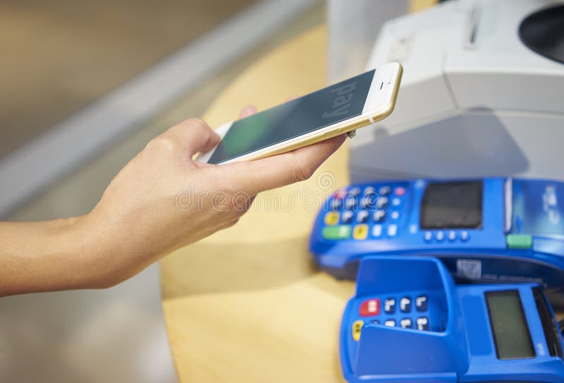 Paying with mobile phone stock photo. Image of buyer - 68511988