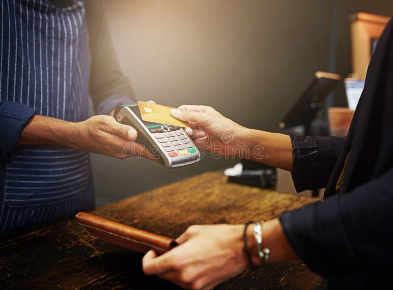 Payment Made with Just a Single Tap. a Customer Paying Using NFC ...