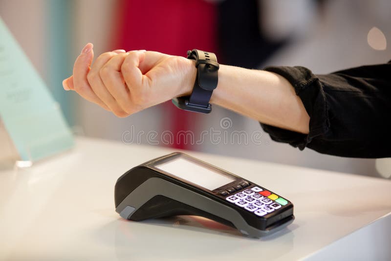 Payment for Services Using a Watch through the Terminal Stock Photo ...