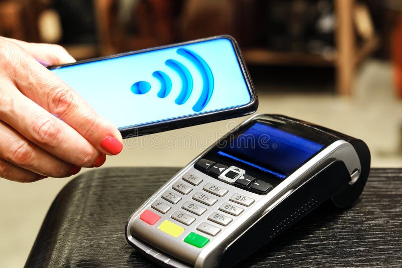 Payment by Smartphone in the Payment Terminal. Electronic Money. Mobile ...