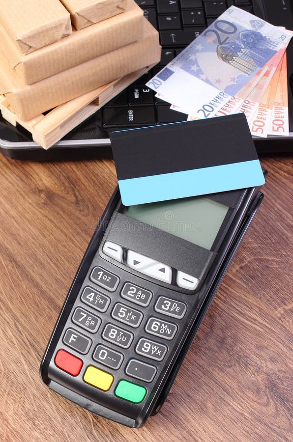 Payment Terminal with Credit Card, Currencies Euro, Laptop and Wrapped ... Payment Terminal with Credit Card, Currencies Euro, Laptop and Wrapped ...