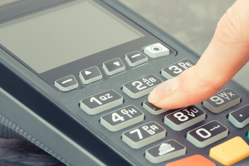 Payment Terminal and Finger Entering PIN Code. Credit Card Reader Using ...