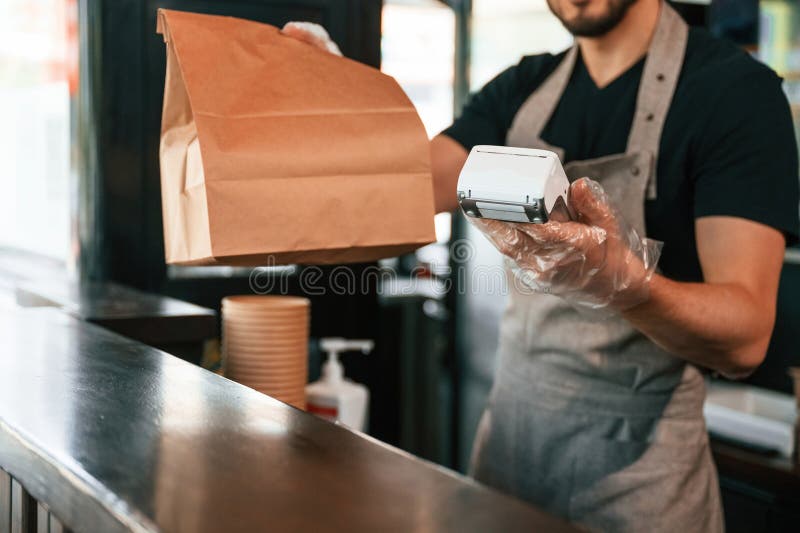 Payment by Using Terminal, Order is Ready. Man is Serving Delicious ...