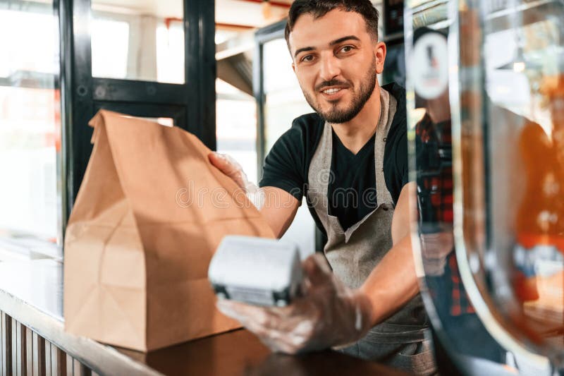 Payment by Using Terminal, Order is Ready. Man is Serving Delicious ...