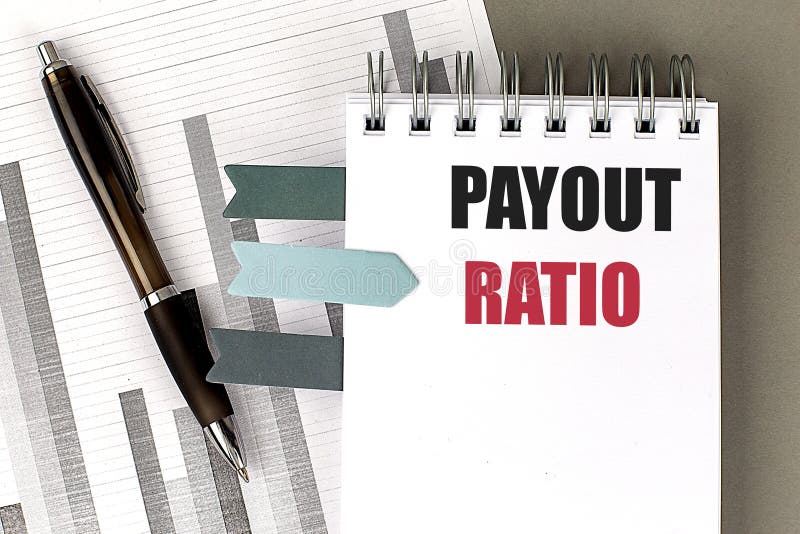 PAYOUT RATIO Text on Notebook with Chart on Gray Background Stock Photo ...