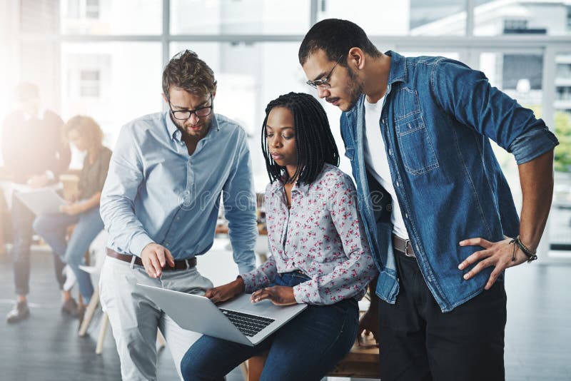 It Pays To Be a Part of a Hardworking Team. a Group of Colleagues Using ...