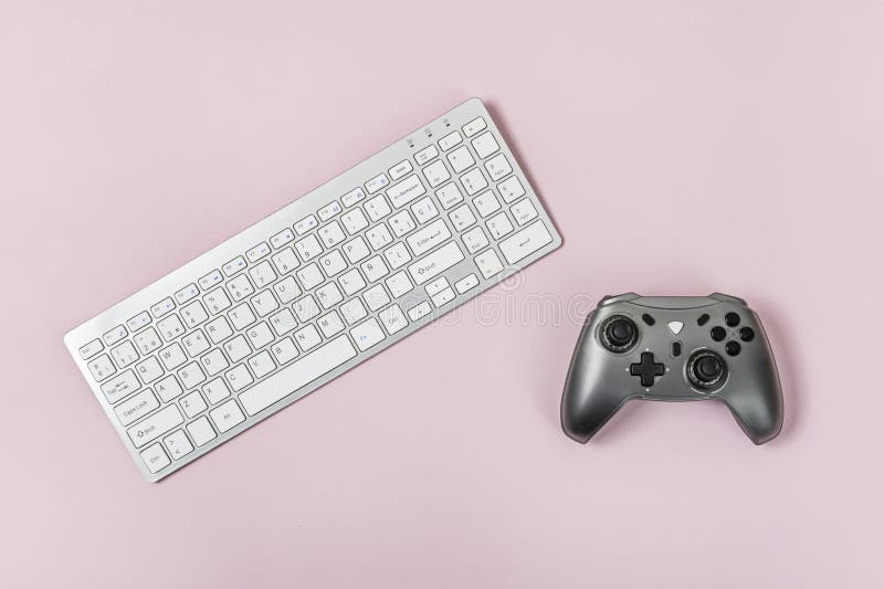 PC Keyboard and Gamepad on a Smooth Pink Surface Stock Photo - Image of ...