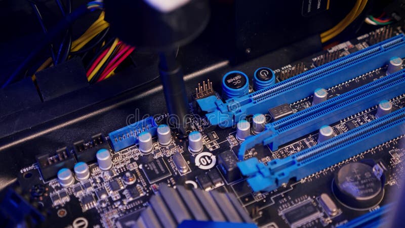 PC Technician Serves Modern Motherboard Close Up. Upgrading Computer ...