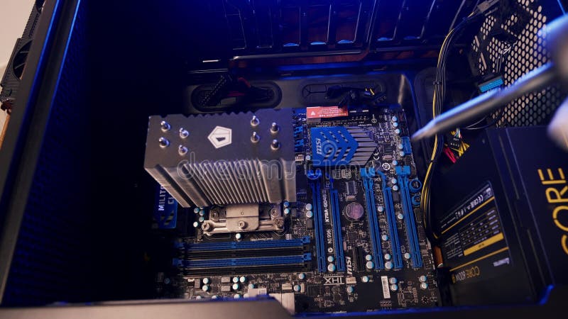 PC Technician Serves Modern Motherboard Close Up. Upgrading Computer ...