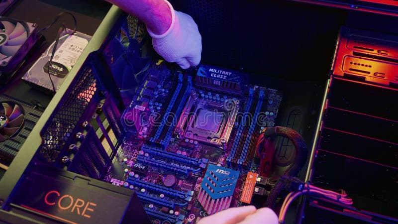 PC Technician Serves Modern Motherboard Close Up. Upgrading Computer ...