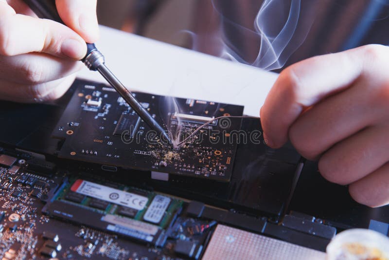 PC Technology .Computer Repair Shop. Engineer Performing Laptop ...