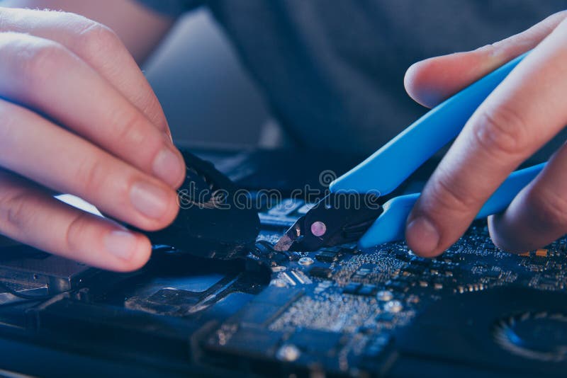 PC Technology .Computer Repair Shop. Engineer Performing Laptop ...