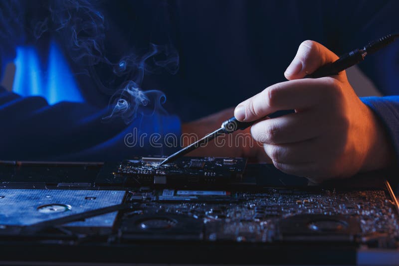 PC Technology .Computer Repair Shop. Engineer Performing Laptop ...