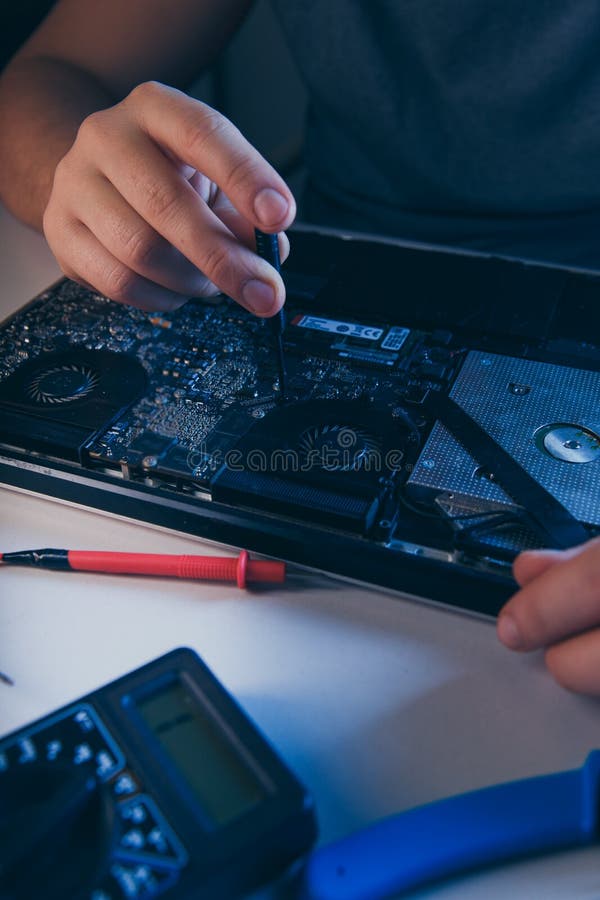 PC Technology .Computer Repair Shop. Engineer Performing Laptop ...
