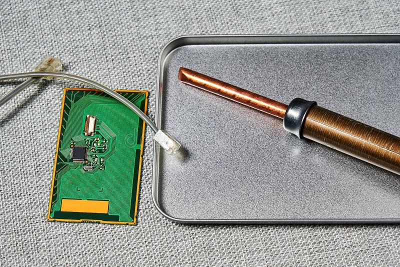 PCB with a Microchip, Connectors, Wires, Soldering Iron in the ...