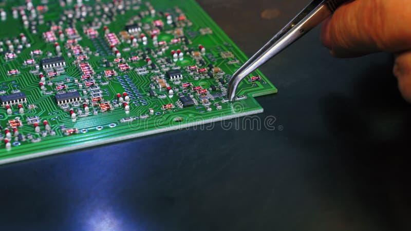 PCB Printed Circuit Board on Black Table Ready for Repair. Assembling ...