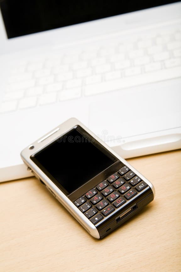 PDA phone and laptop stock image. Image of front, laptop - 5063943