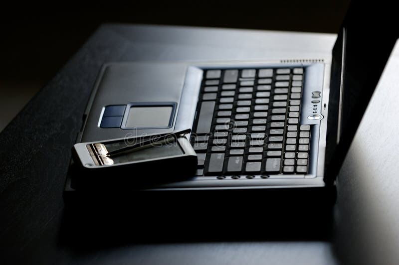 PDA on top of laptop stock image. Image of keyboard, bright - 89959