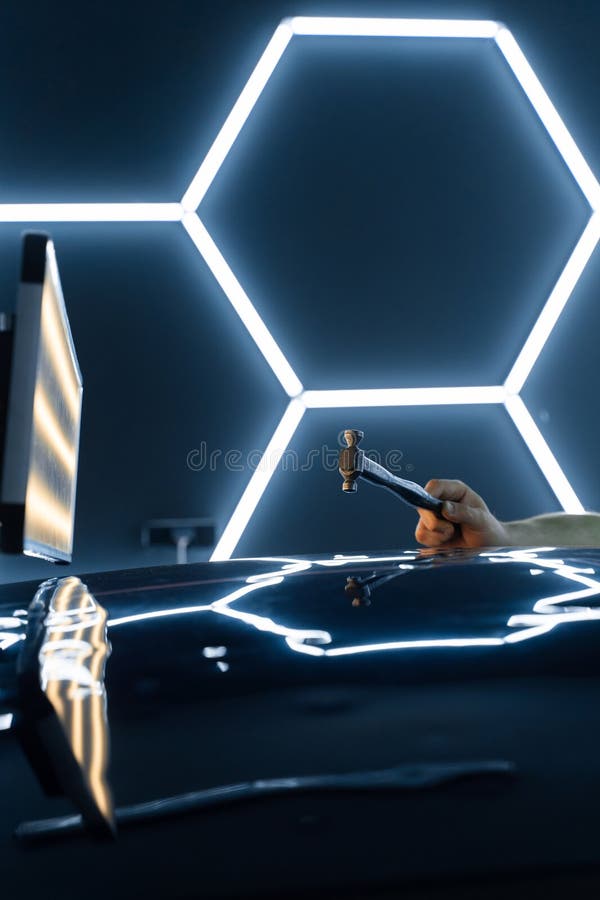 PDR Technician Pulls a Dent from the Car Panel Using Glue Tabs and a ...