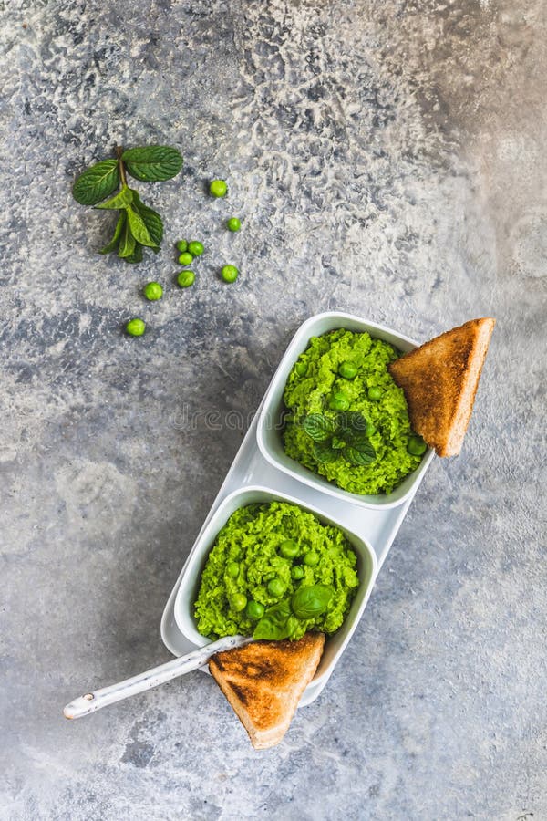 Pea Puree with Basil and Roasted Bread on Rustic Gray Background Stock ...